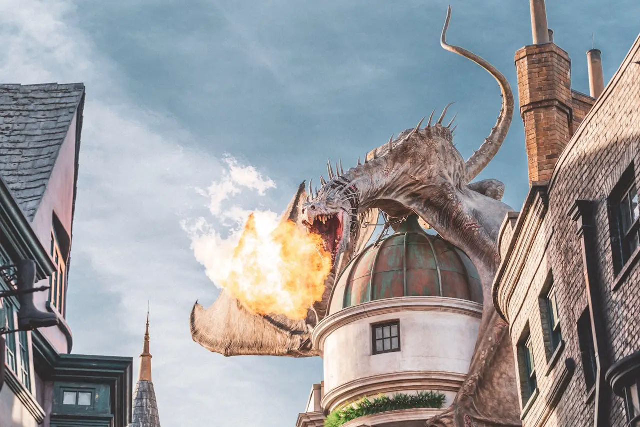 Fire-breathing dragon atop Gringotts Bank at The Wizarding World of Harry Potter in Universal Orlando, a popular family vacation attraction.